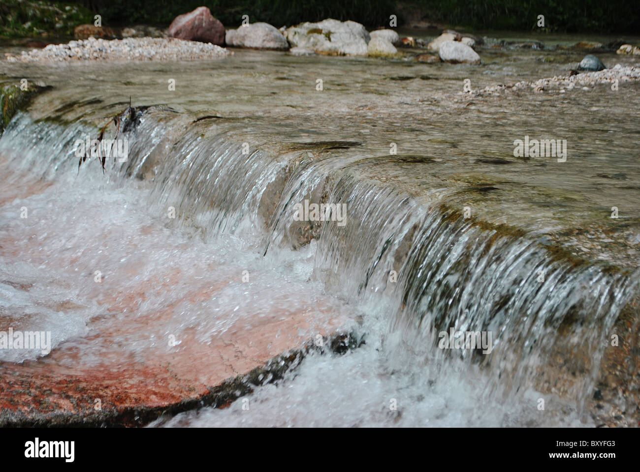 pure and sparkling waterfall falling over rocks Stock Photo - Alamy