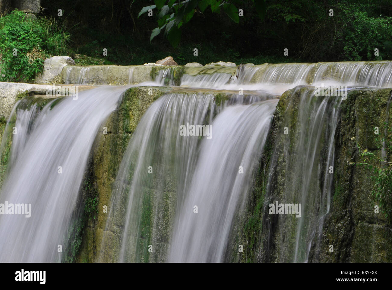 pure and sparkling waterfall falling over rocks Stock Photo - Alamy