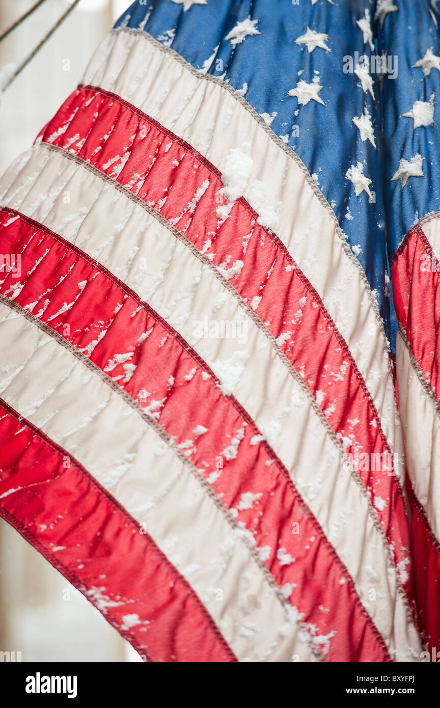 Snow covered American flag Stock Photo - Alamy