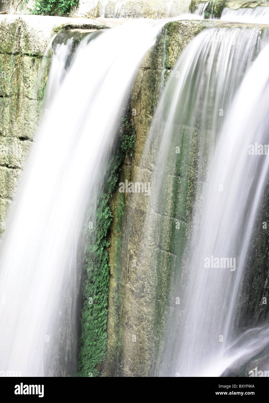 pure and sparkling waterfall falling over rocks Stock Photo - Alamy