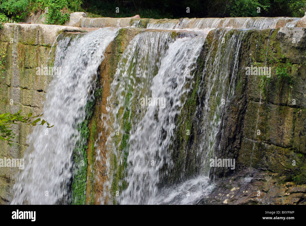 pure and sparkling waterfall falling over rocks Stock Photo - Alamy