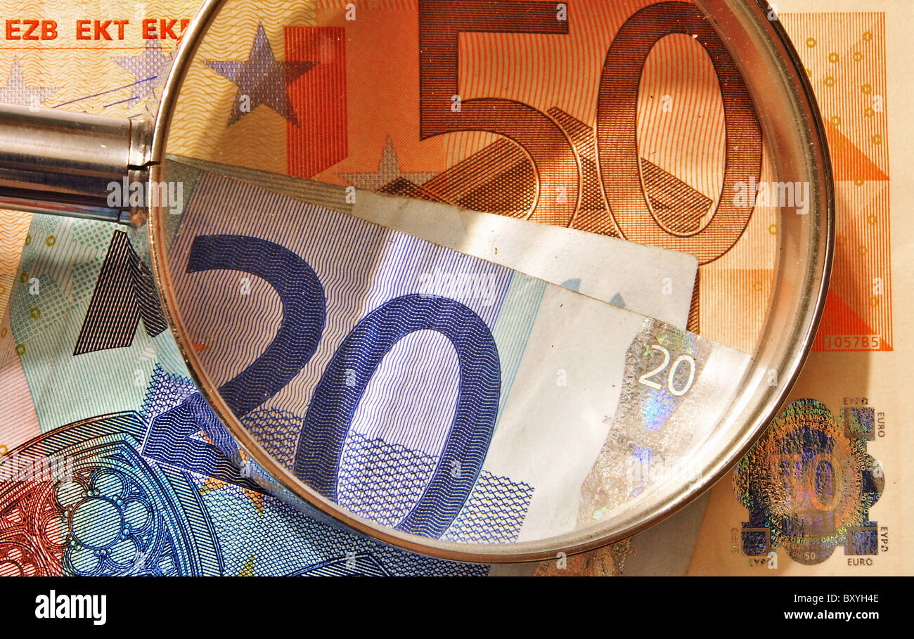 euro currency enlarged with a magnifying glass, euro in Europe Stock ...