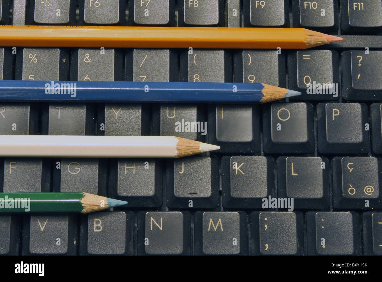 PC keyboard with colored pencils, clipboard Stock Photo - Alamy