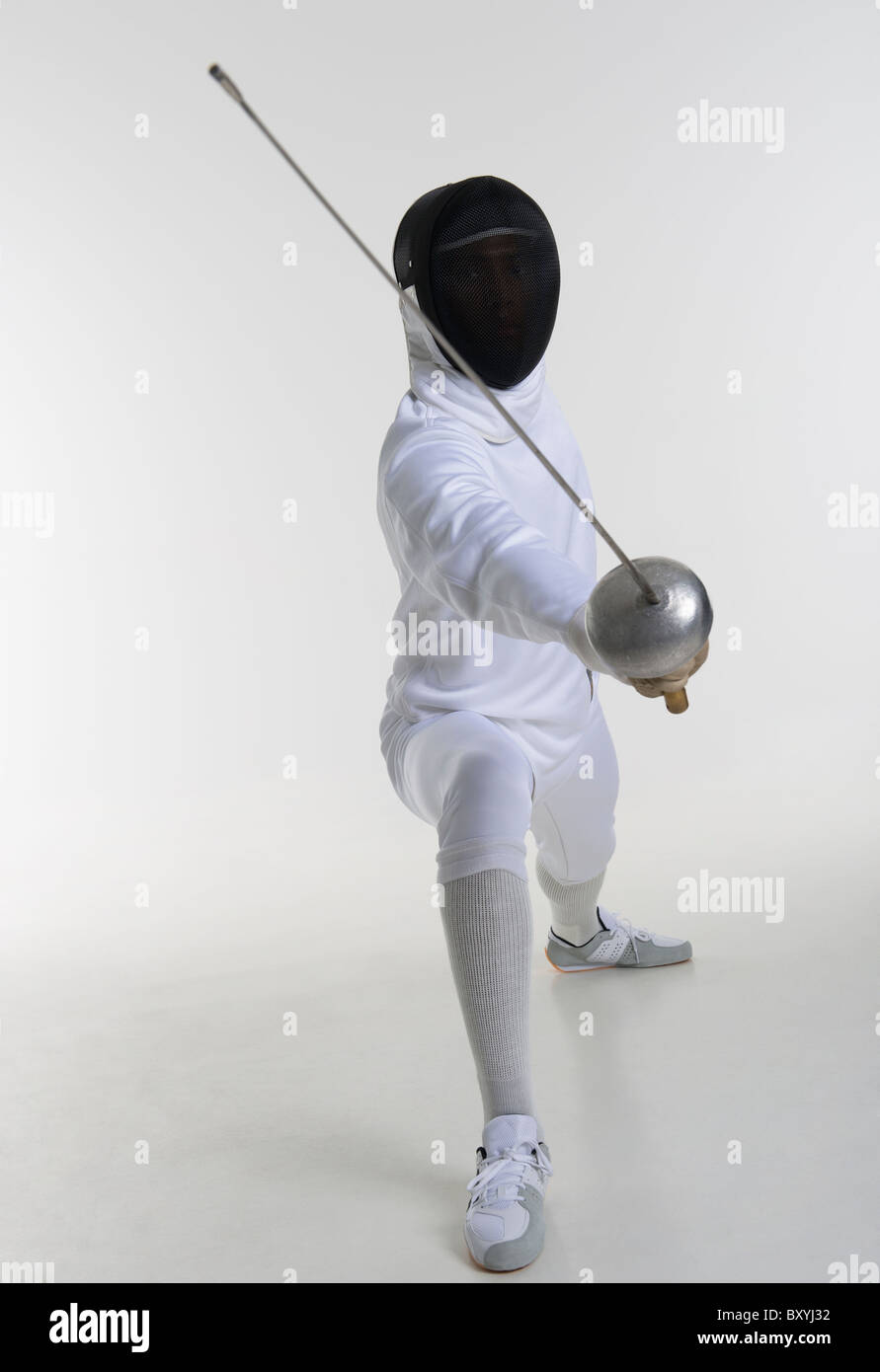 Studio portrait of fencer holding fencing foil Stock Photo - Alamy