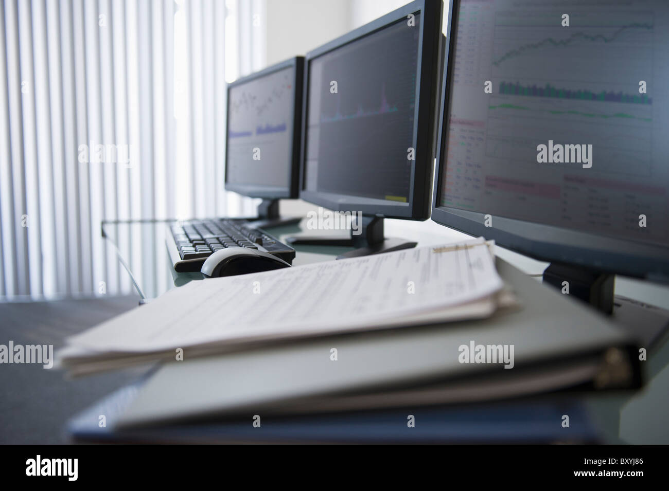 Close up of computer monitors in office Stock Photo - Alamy
