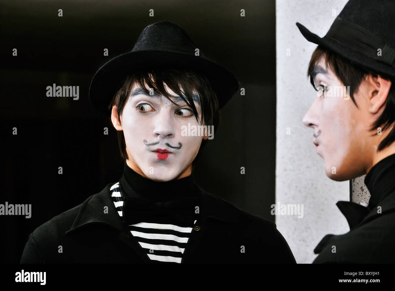 mime actor at a mirror. Close-up Stock Photo - Alamy