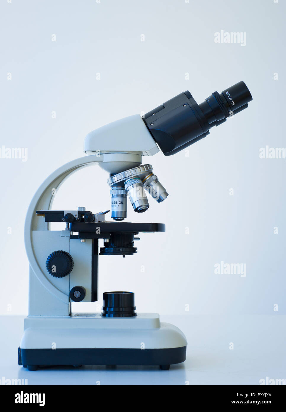 Microscope on white background Stock Photo - Alamy