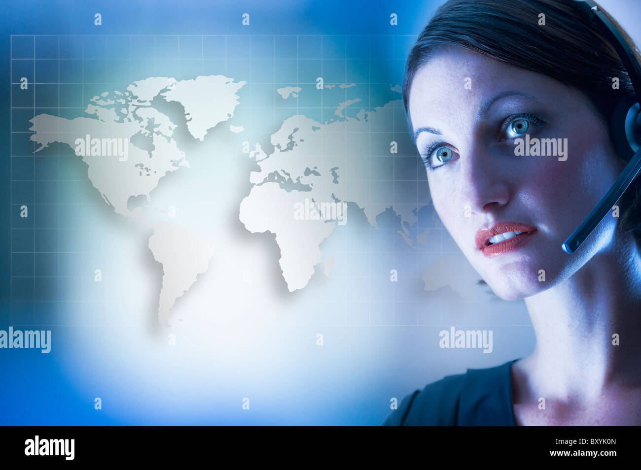 Customer service representative in front of world map Stock Photo - Alamy