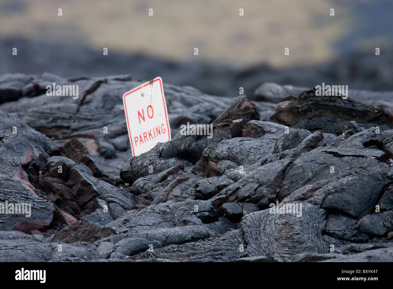 No parking sign buried in a fresh lava flow at the end of Chain of ...