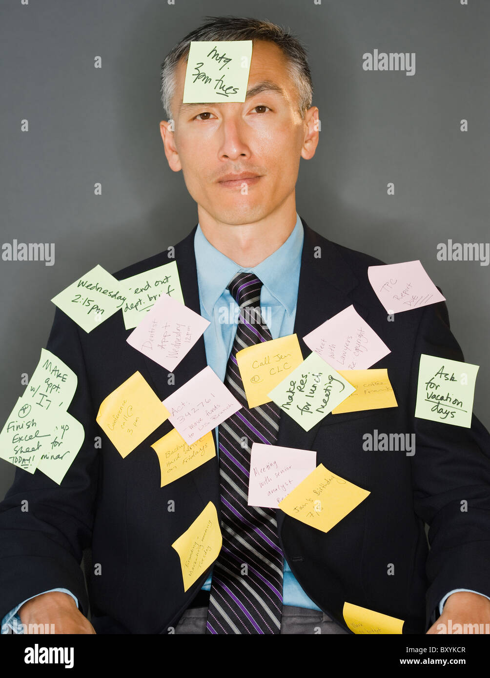 Businessman with post-it sticking on him, studio shot Stock Photo - Alamy