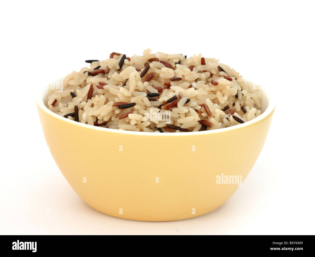 Close up view of cooked variety of rice sorts in yellow bowl - basmati ...