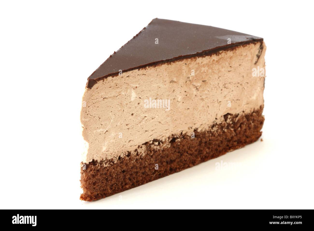 Close up view of slice of chocolate cake with filling on white ...