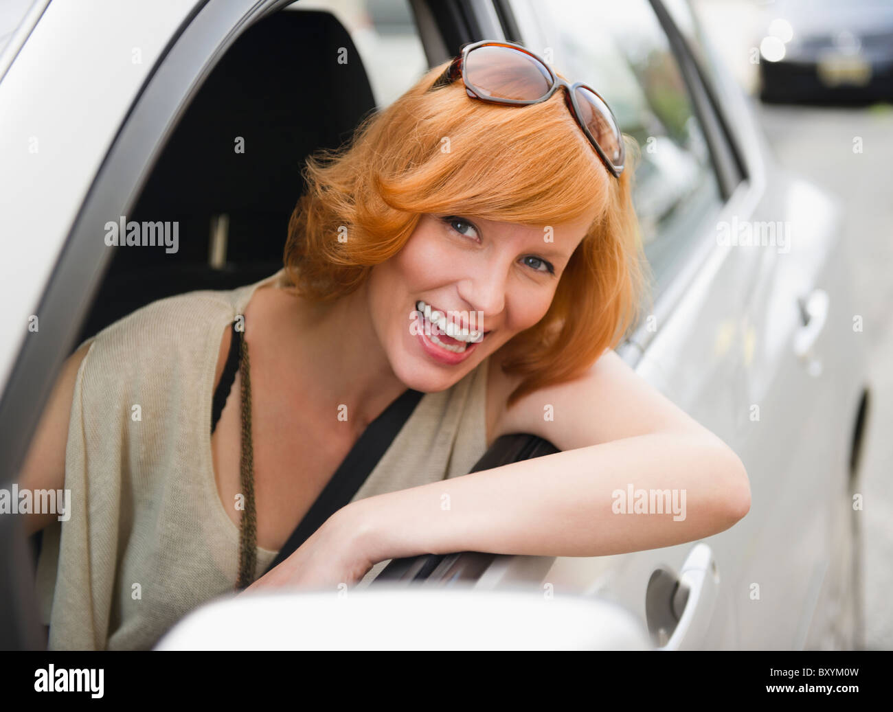 Portrait of young woman driving car Stock Photo - Alamy