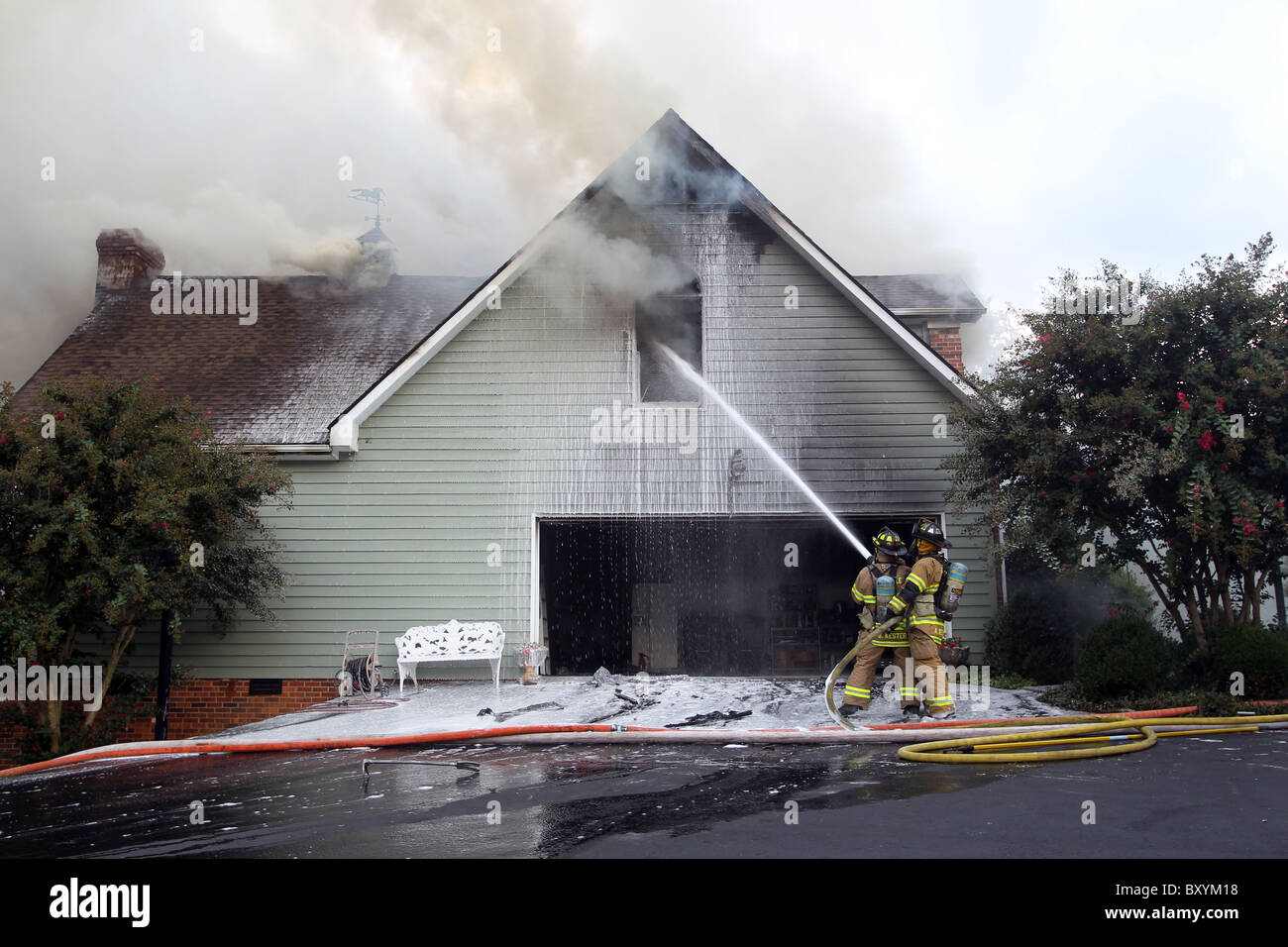 Firefighters work together to put out a house fire in Charlottesville ...