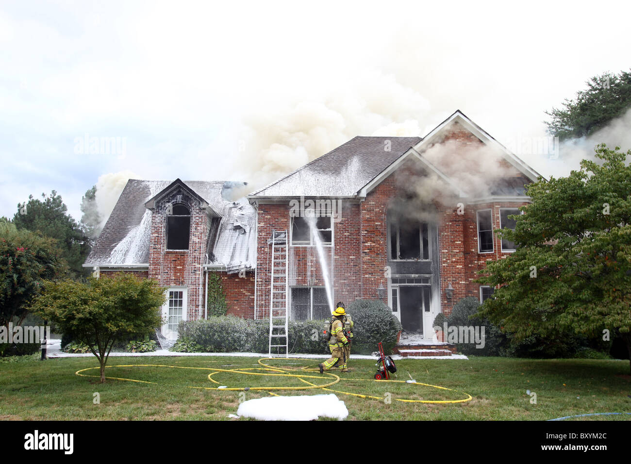 Firefighters putting out fire in hi-res stock photography and images ...
