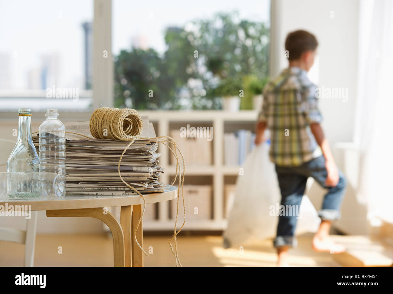 Boy sorting garbage at home Stock Photo - Alamy