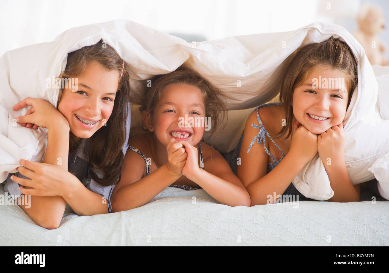 Portrait three sisters lying on hi-res stock photography and images - Alamy