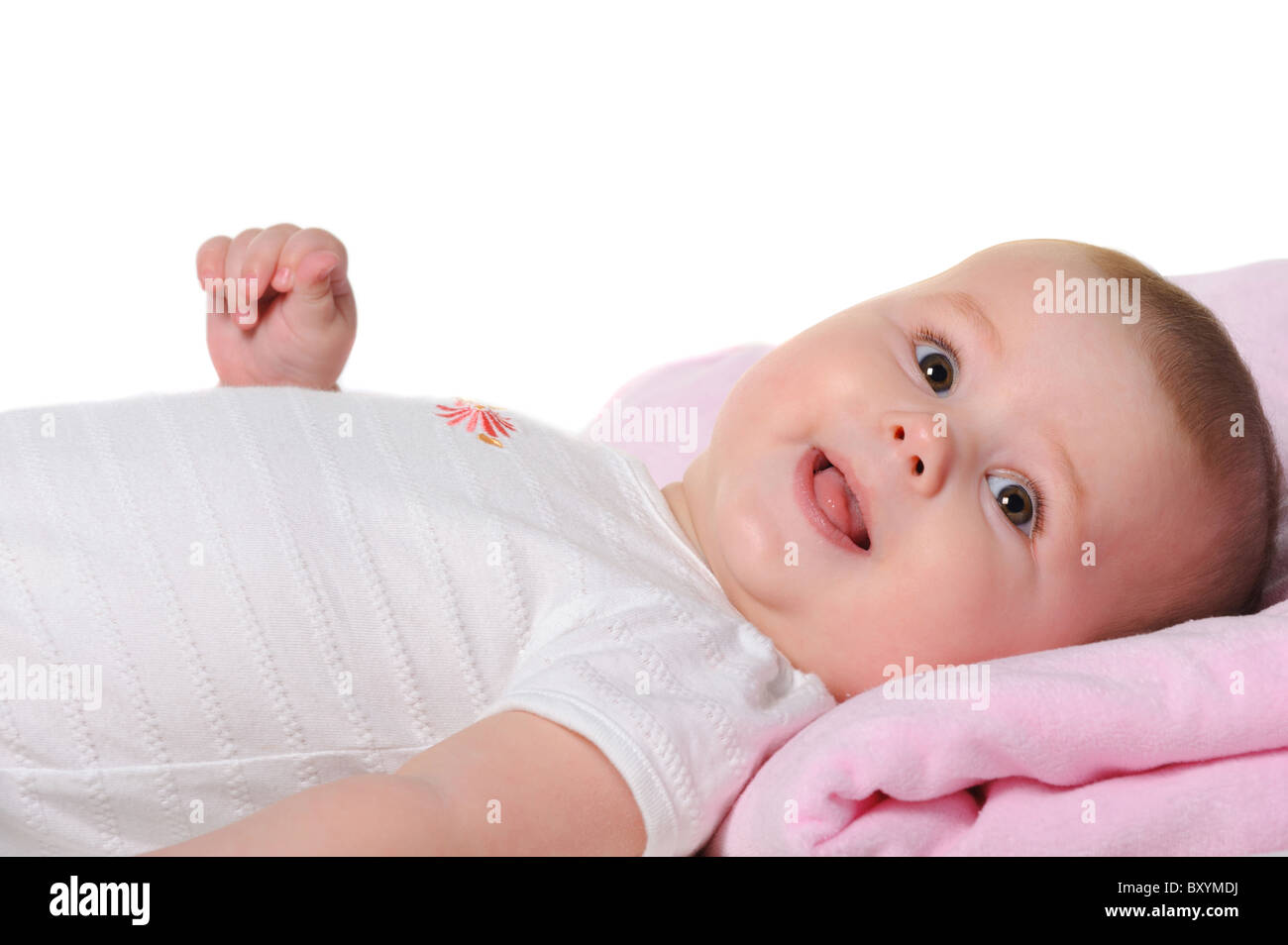 The baby lays. Age of 8 months. It is isolated on a white background ...