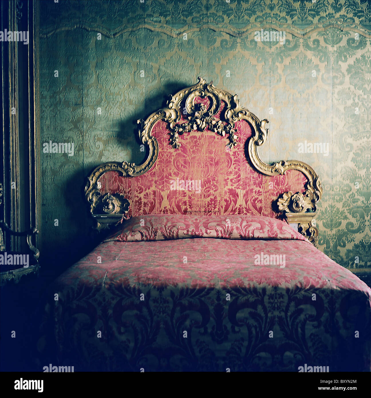 A period bed set in an old room Stock Photo - Alamy