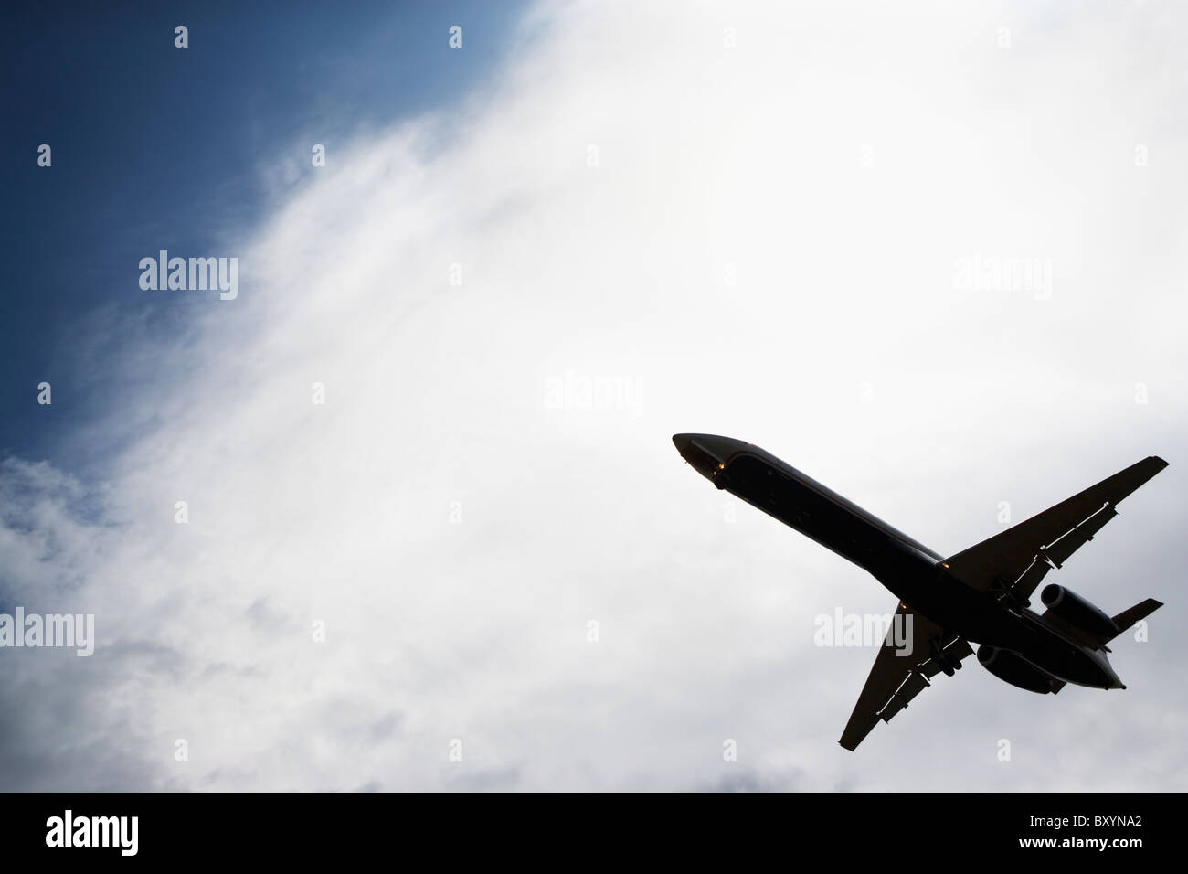 Silhouette of flying airplane Stock Photo - Alamy