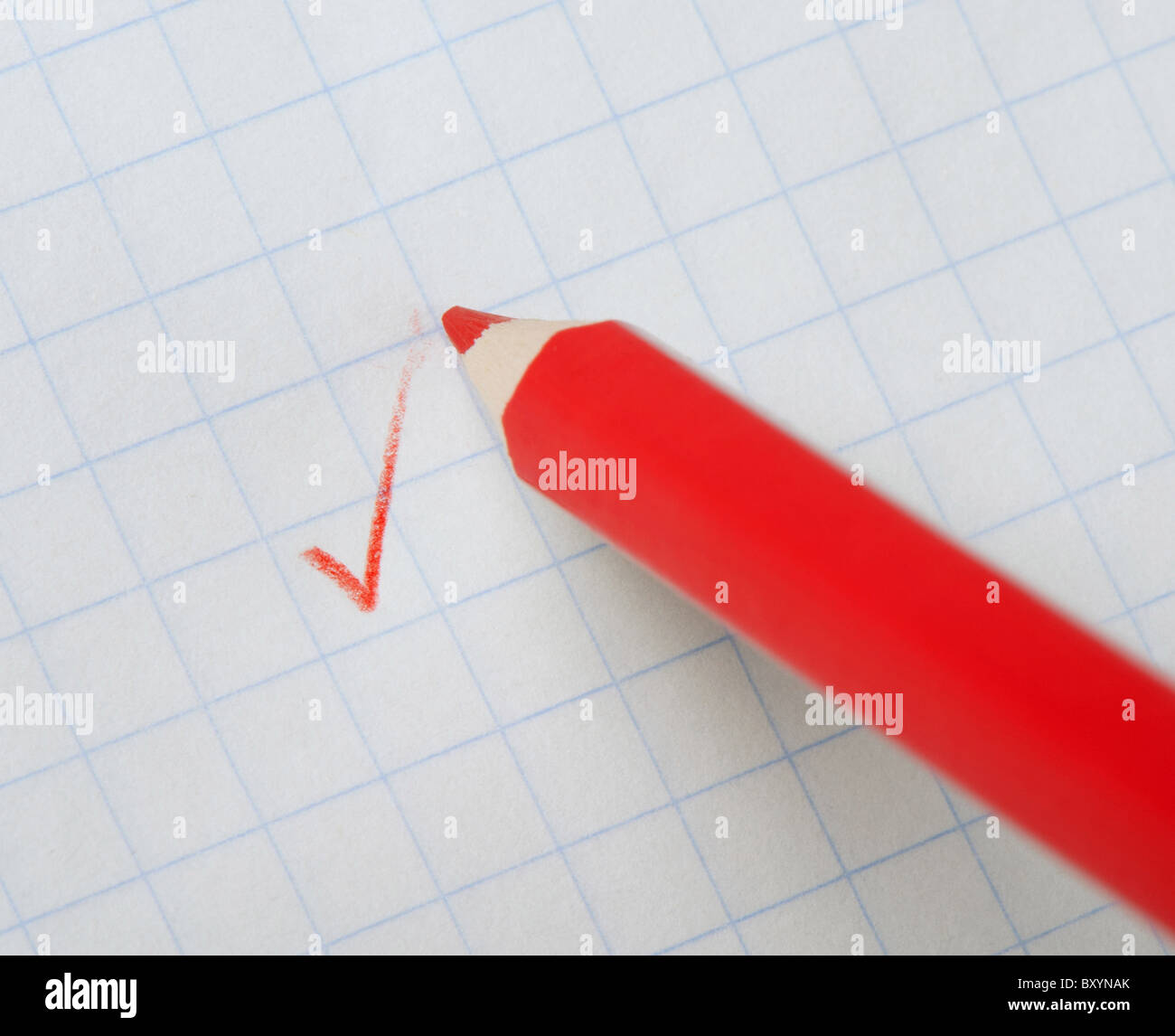 Red pencil writing a mark. Abstract concept Stock Photo - Alamy