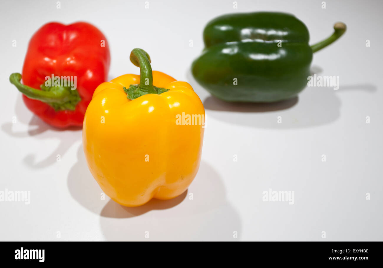 Cutout of three coloured bell Peppers Stock Photo - Alamy