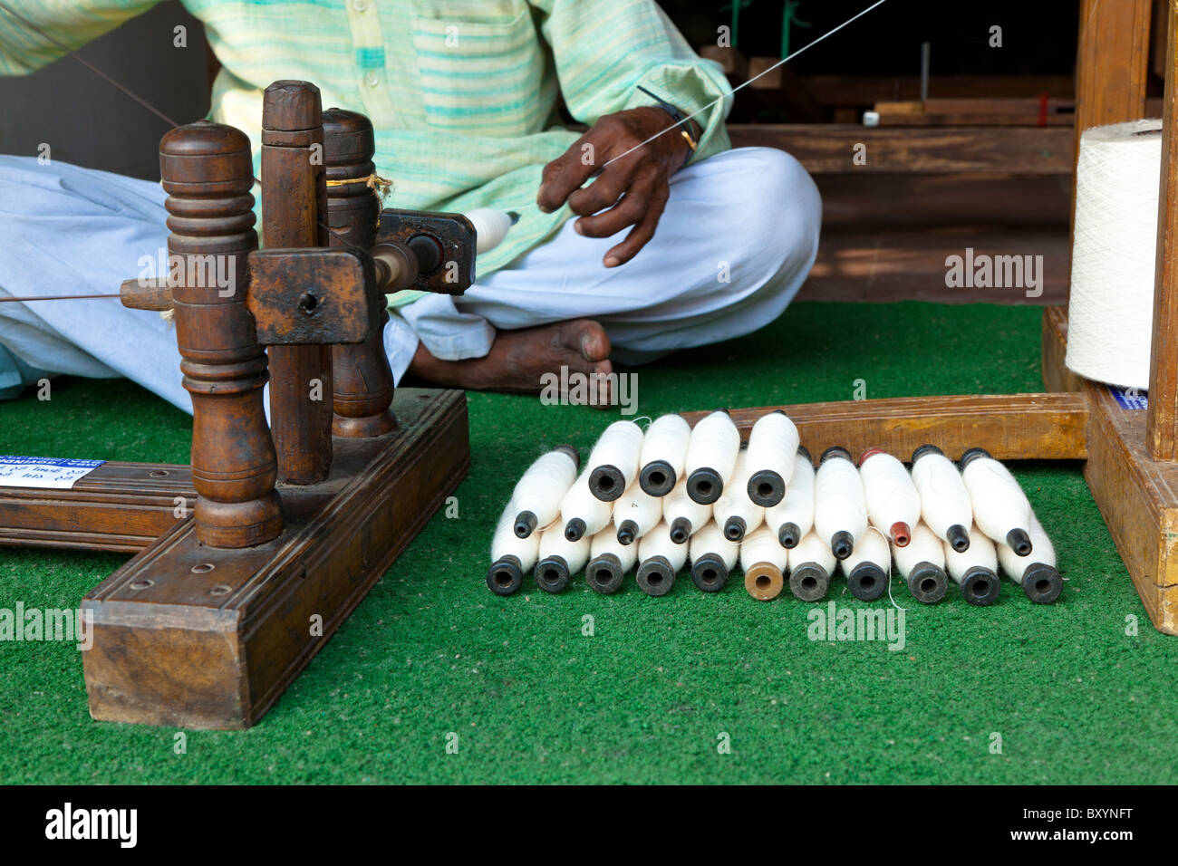 Indian man working with thread Stock Photo - Alamy