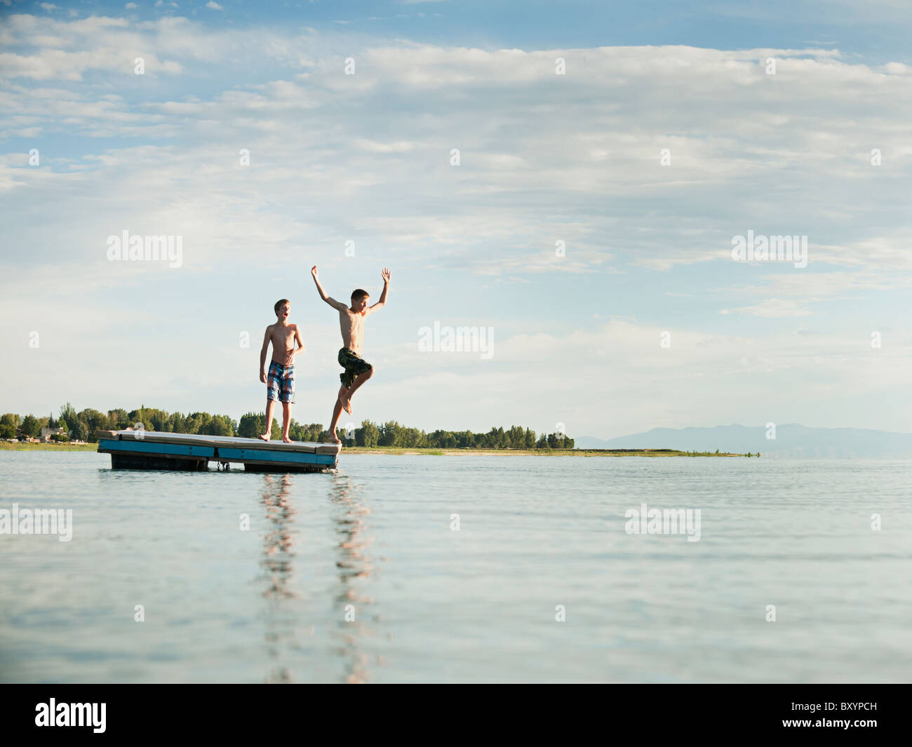 Children jumping into water silhouette hi-res stock photography and ...