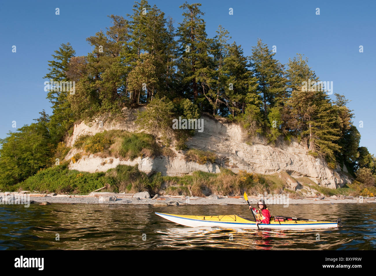 Hispanic woman kayaking on lake Stock Photo - Alamy