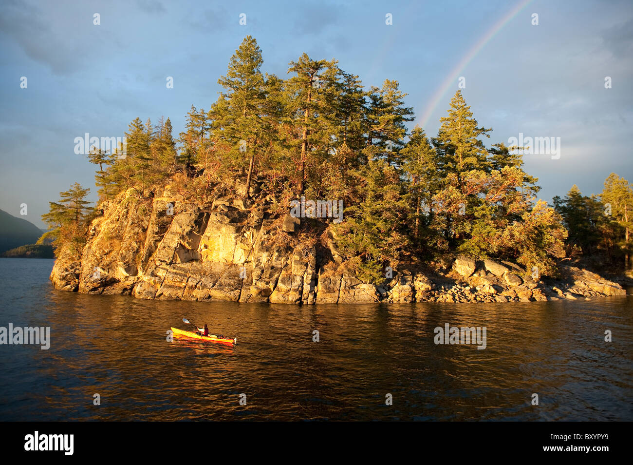 Hispanic woman kayaking on lake Stock Photo - Alamy