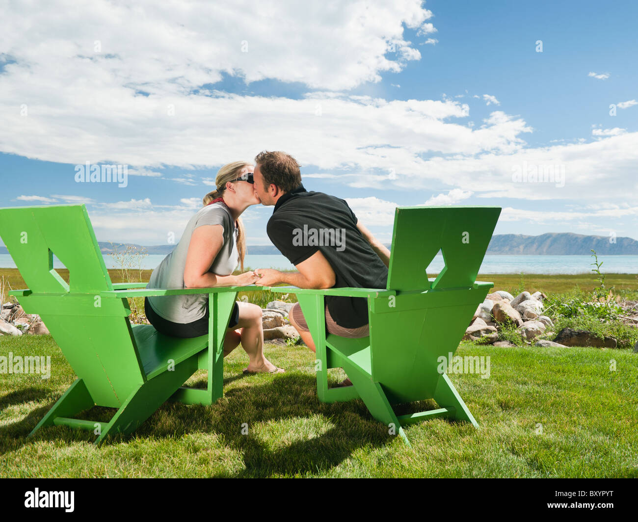 Romantic couple sitting on chair hi-res stock photography and images ...