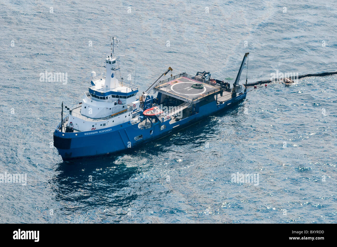 Oil skimming boat collecting oil three miles north of the source MC 252 ...