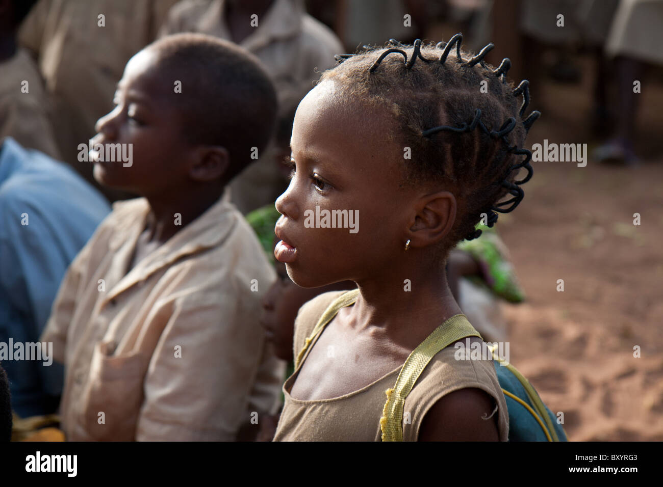 A young child beneficiary learning about the dangers of HIV/AIDS ...