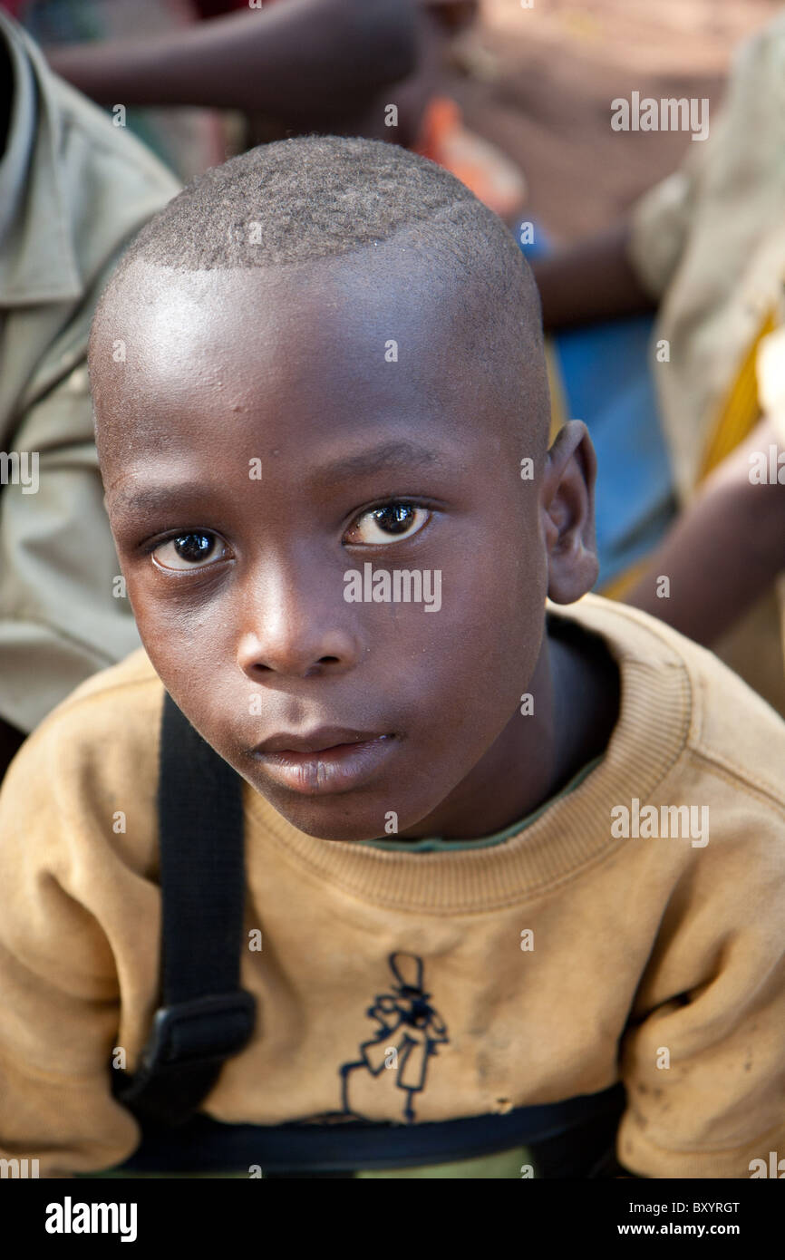 A young child beneficiary learning about the dangers of HIV/AIDS ...