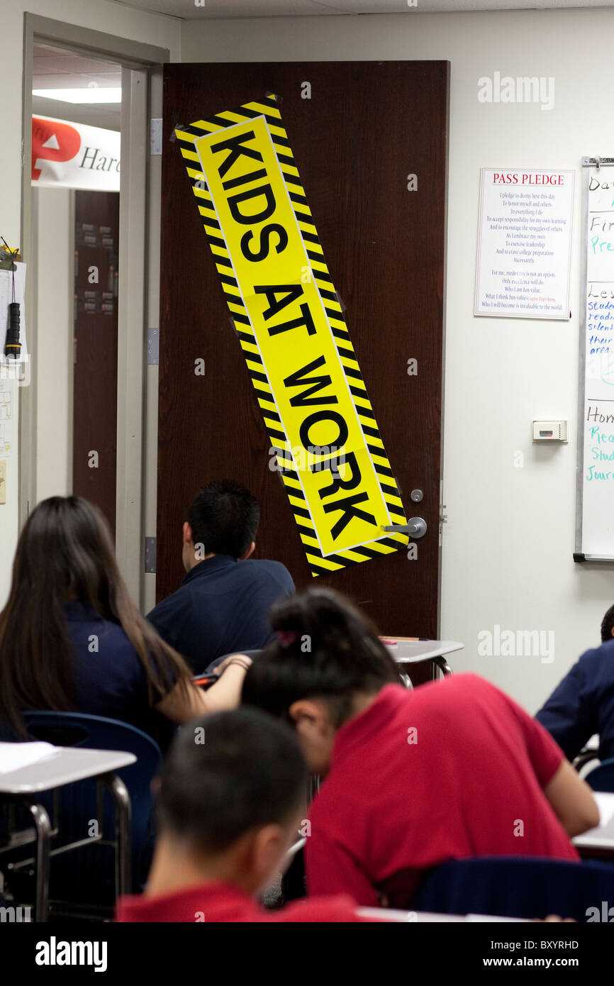 Bright yellow "Kids at Work" sign in classroom at Peak Preparatory ...
