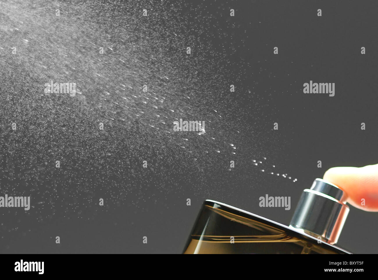 spray from aftershave / perfume bottle Stock Photo - Alamy