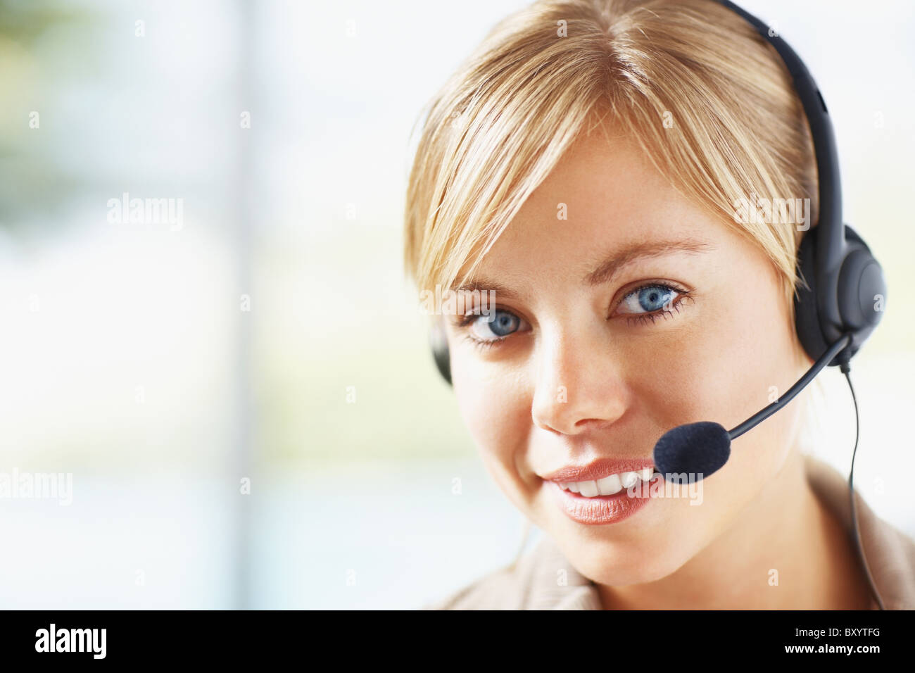 Portrait of young female customer service representative Stock Photo ...