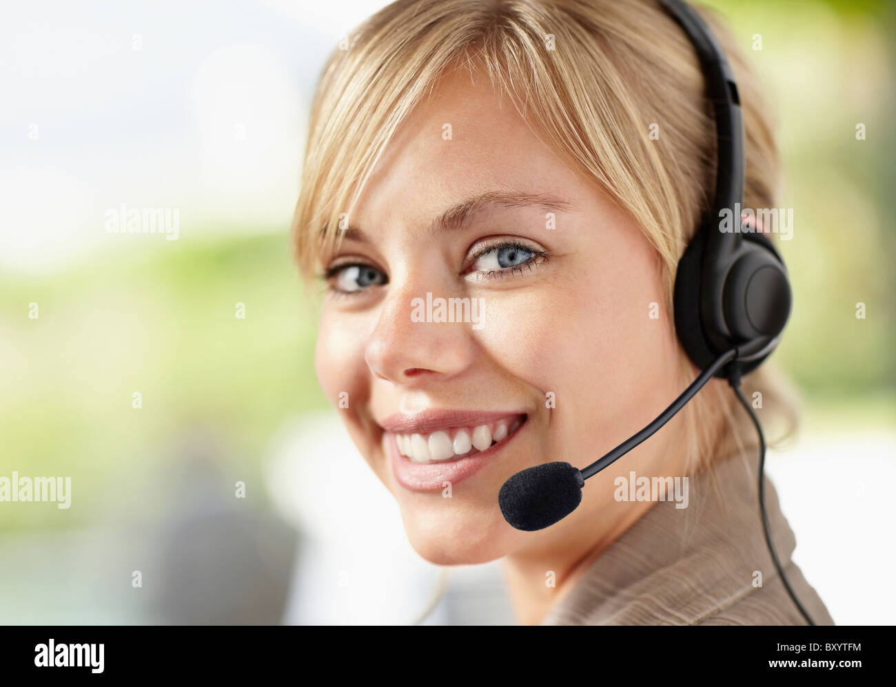 Portrait of young female customer service representative Stock Photo ...