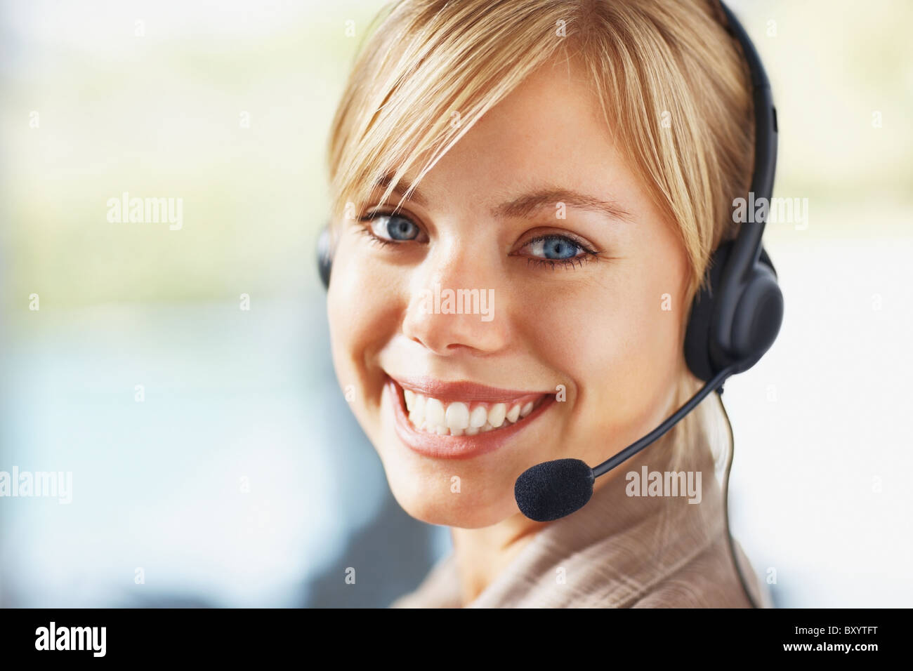 Portrait of young female customer service representative Stock Photo ...