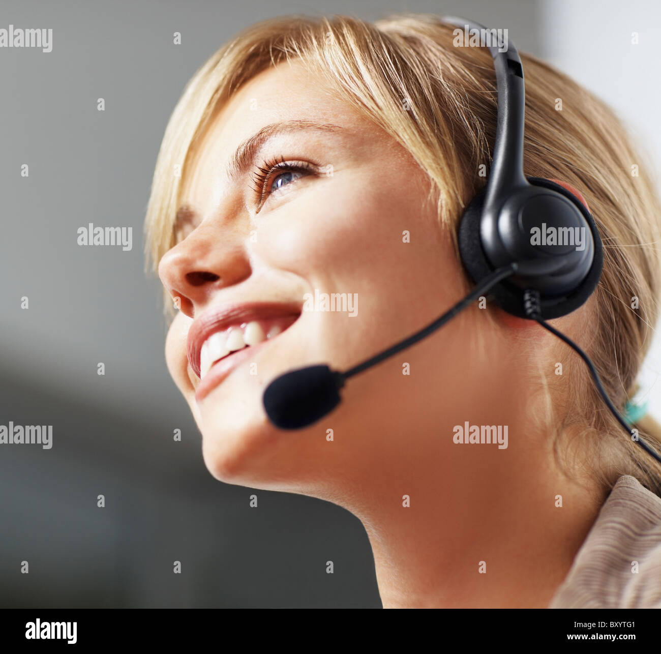 Young female customer service representative Stock Photo - Alamy