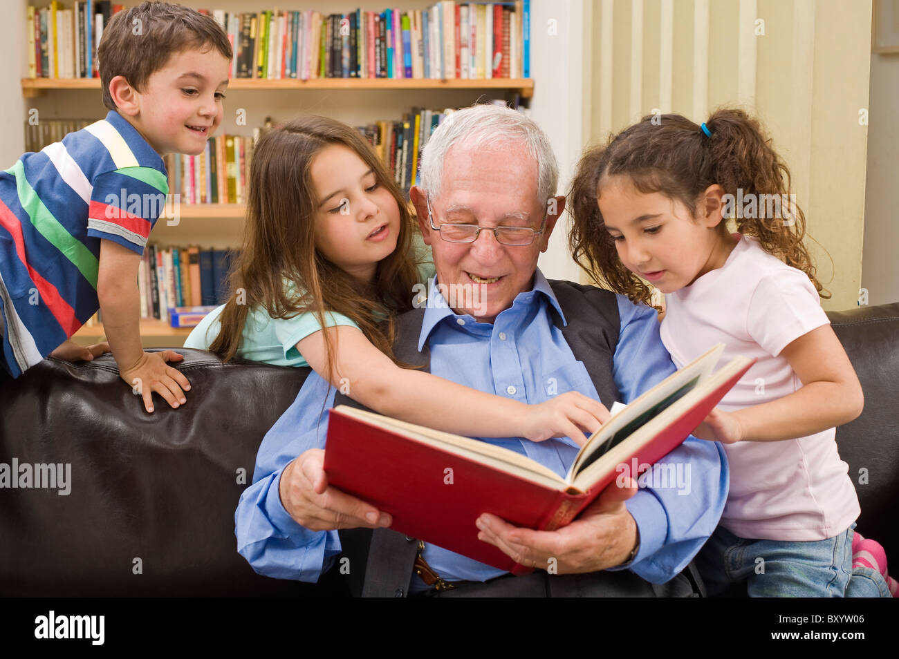 grandfather reading a story to his grandchild Stock Photo - Alamy