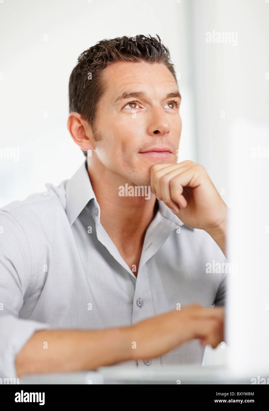 Portrait of good-looking mid adult man contemplating Stock Photo - Alamy