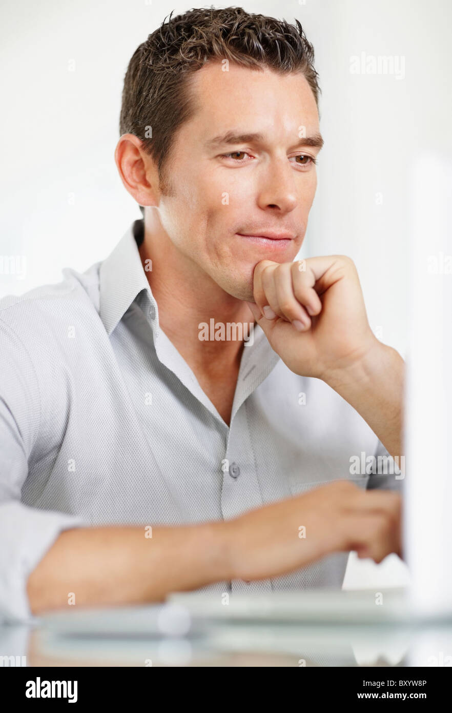 Portrait of good-looking mid adult man contemplating Stock Photo - Alamy