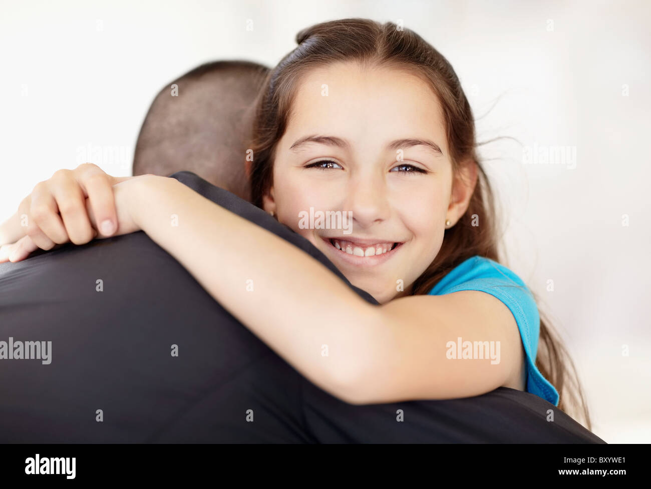 Father coming back from work embracing daughter Stock Photo - Alamy
