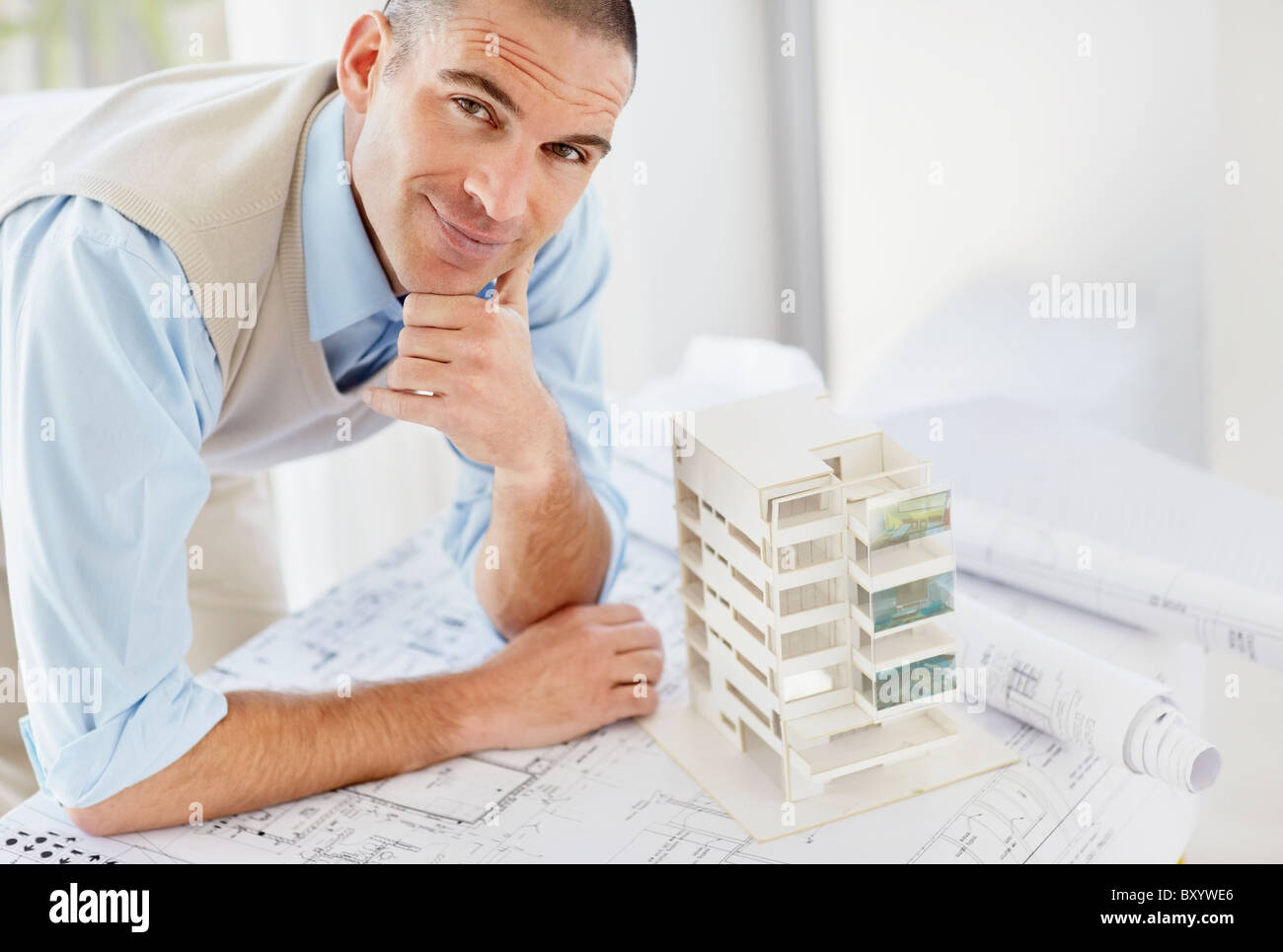 Portrait of architect with apartment model Stock Photo - Alamy