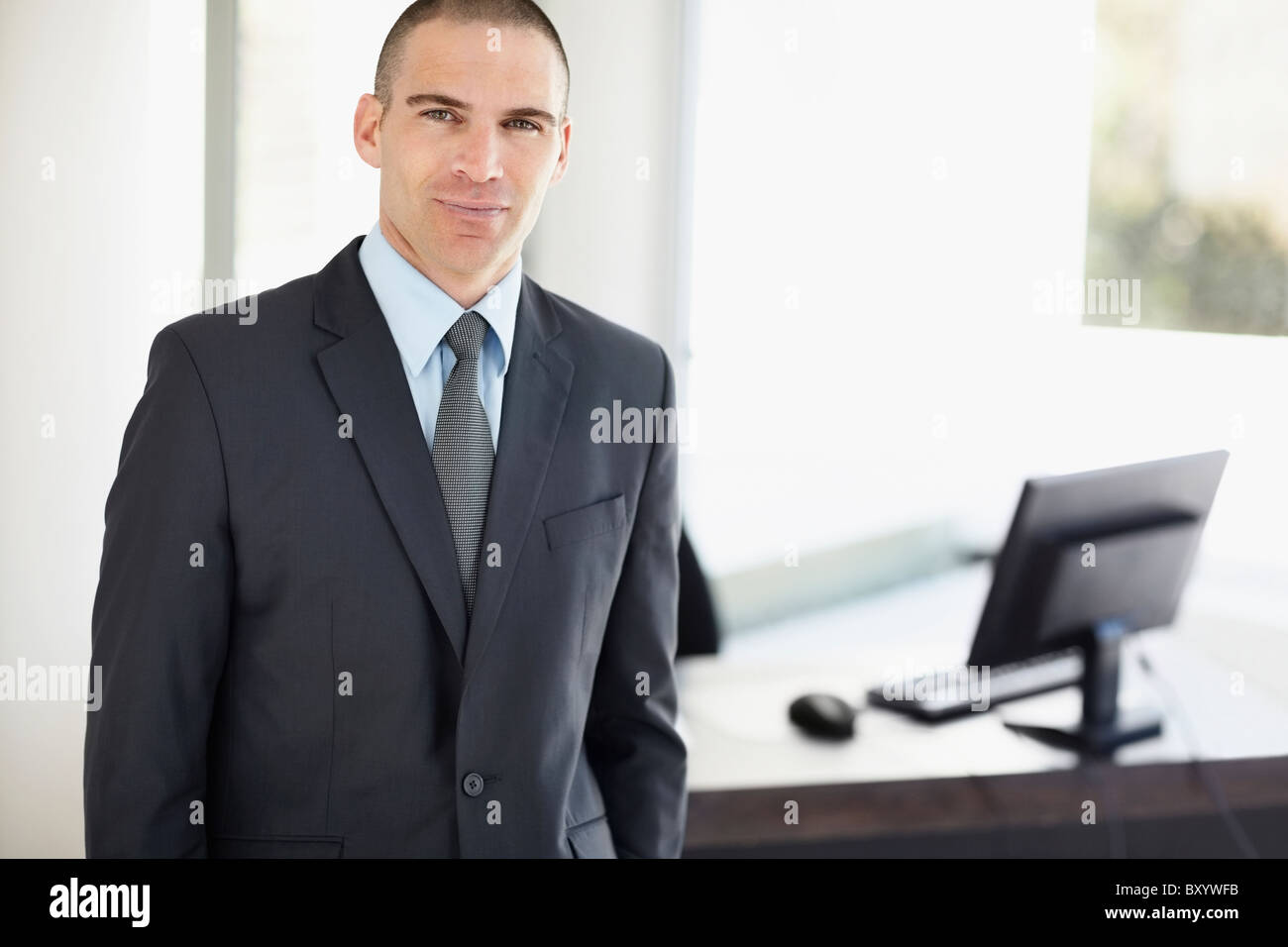 Portrait of businessman in office environment Stock Photo - Alamy