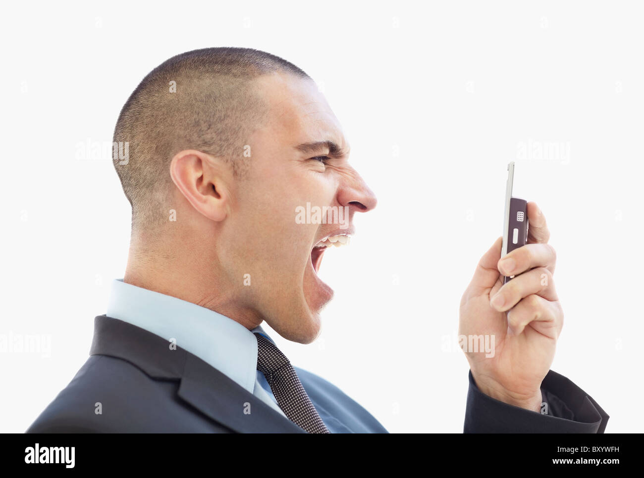 Angry businessman shouting at mobile phone Stock Photo - Alamy