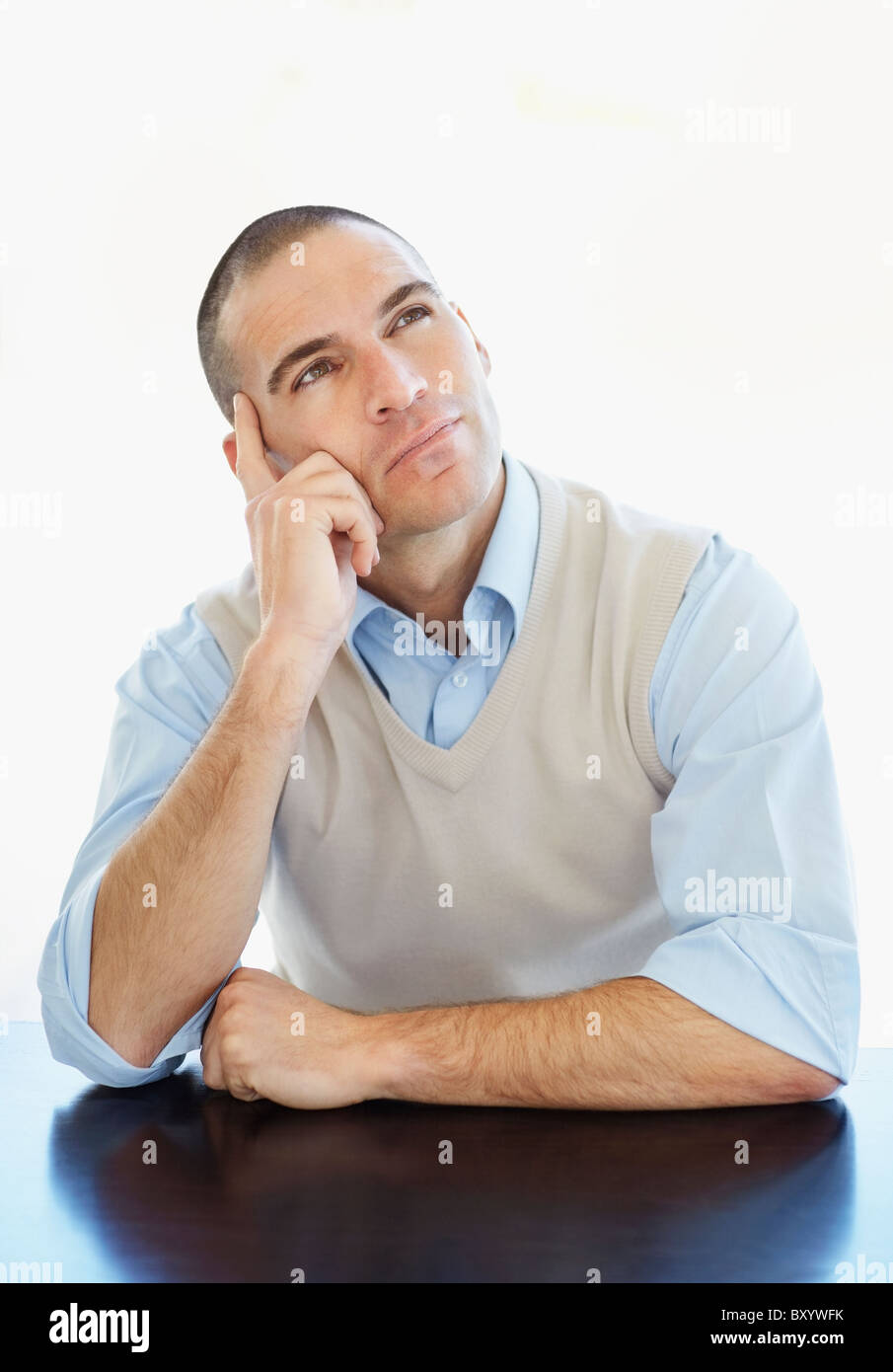 Mid adult man contemplating Stock Photo - Alamy