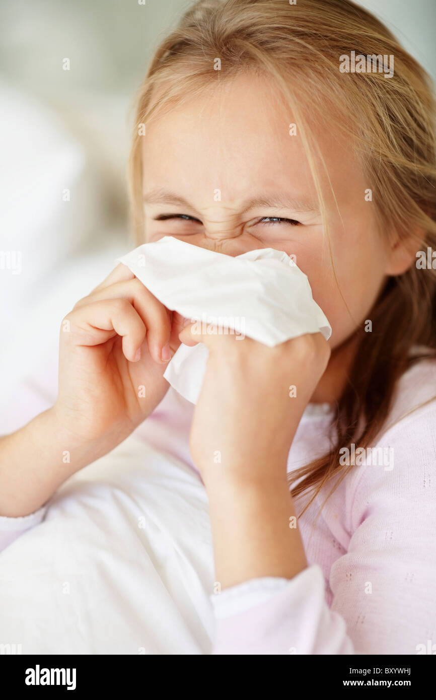 Girl blowing nose Stock Photo - Alamy