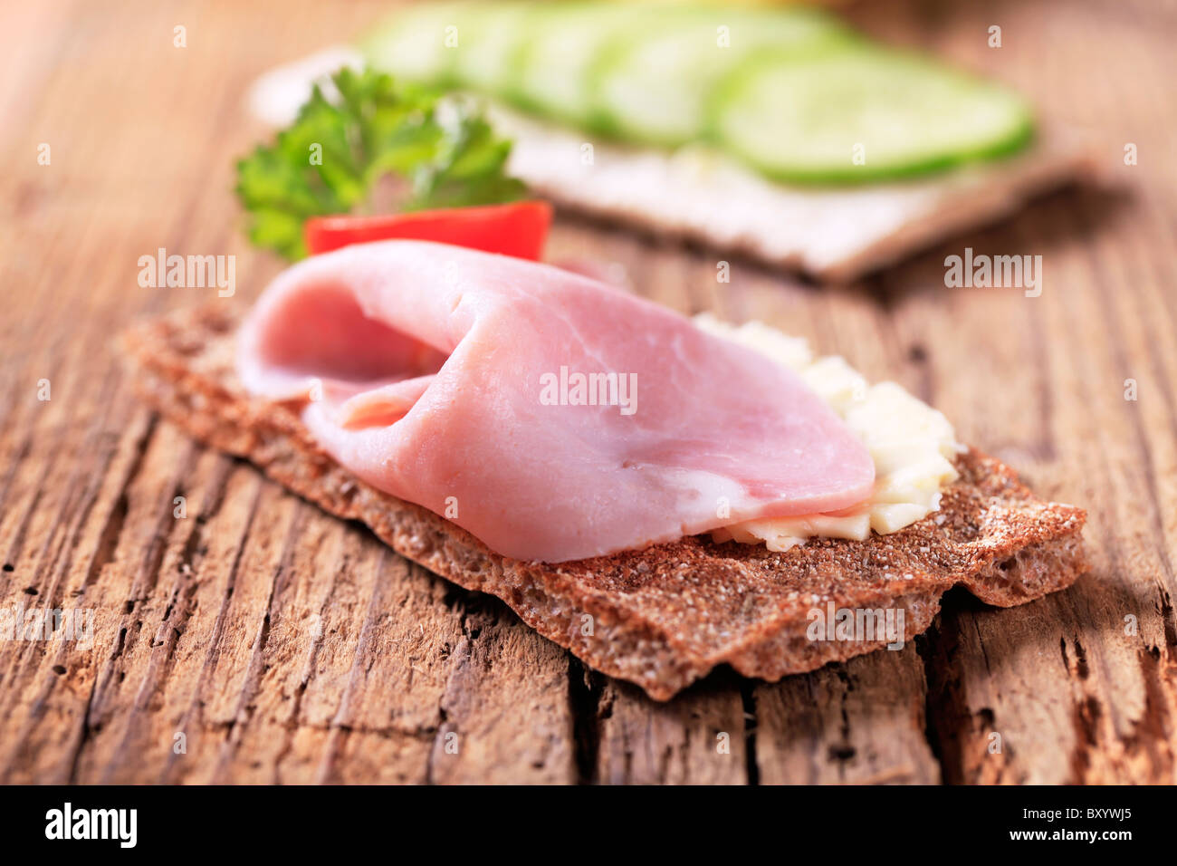 Whole grain crisp bread and ham Stock Photo - Alamy